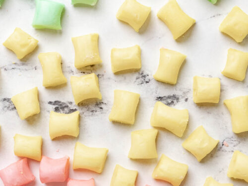 Butter Mints pink yellow and green mints on marble surface