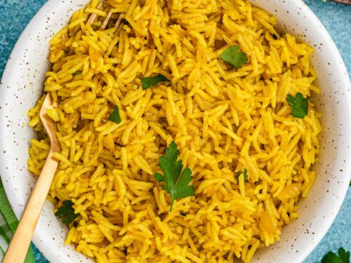 Latin Yellow Rice in bowl garnished with cilantro, 1x1